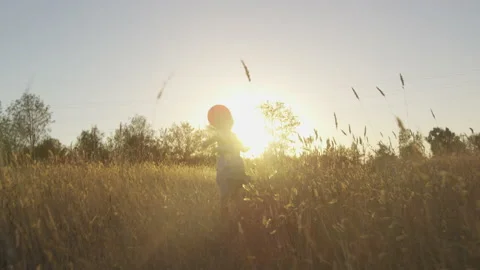 Little Girl Running Through Tall Grass w... | Stock Video | Pond5