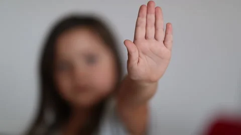 Little girl signalling to STOP with hand | Stock Video | Pond5