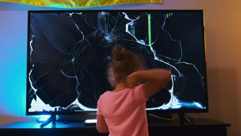 little girl smashing LCD TV screen with ... | Stock Video | Pond5