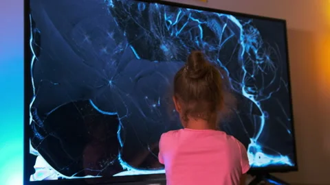 little girl smashing LCD TV screen with ... | Stock Video | Pond5