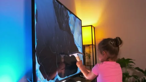 little girl smashing LCD TV screen with ... | Stock Video | Pond5