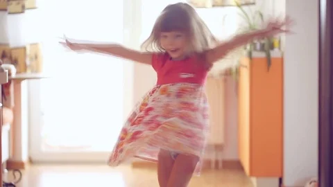 Little girl is spinning around inside th... | Stock Video | Pond5