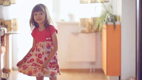 Little girl is spinning around inside th... | Stock Video | Pond5
