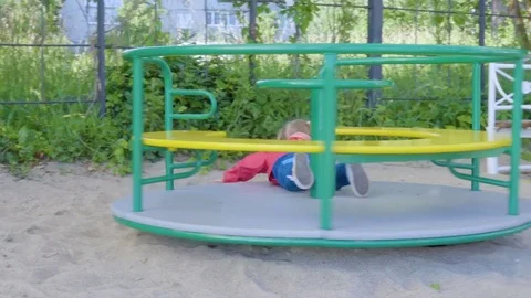 Little Girl Spinning, Rotating on a Merr... | Stock Video | Pond5