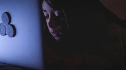 little girl watching computer monitor in... | Stock Video | Pond5