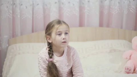 little girl watching TV | Stock Video | Pond5