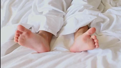 Little girl's feet stick out from under ... | Stock Video | Pond5