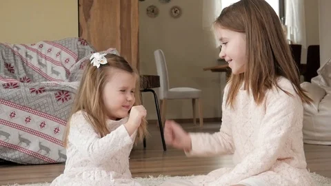 Little girls Kids play a Hand Game at Ho... | Stock Video | Pond5