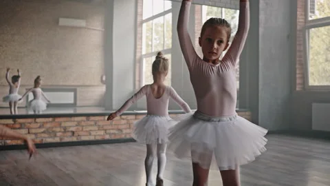 Little girls repeat ballet movement afte... | Stock Video | Pond5