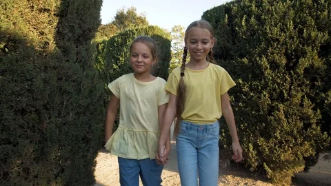 Little girls running in a hedge maze, tw... | Stock Video | Pond5