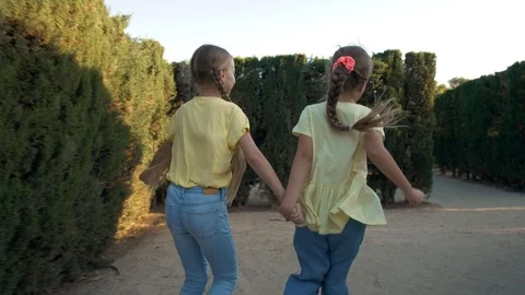 Little girls running in a hedge maze, tw... | Stock Video | Pond5