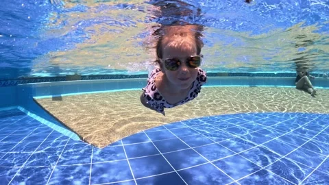 Little girls, sisters, triplets swim in ... | Stock Video | Pond5
