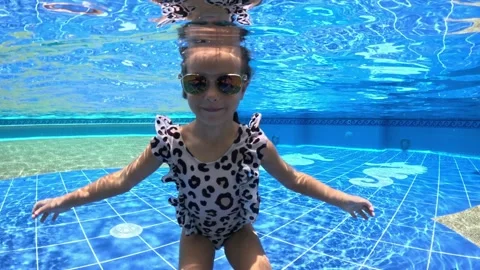 Little girls, sisters, triplets swim in ... | Stock Video | Pond5