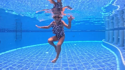 Little girls, sisters, triplets swim in ... | Stock Video | Pond5