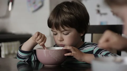 Little Hungry Boy Eating Breakfast Corn ... | Stock Video | Pond5