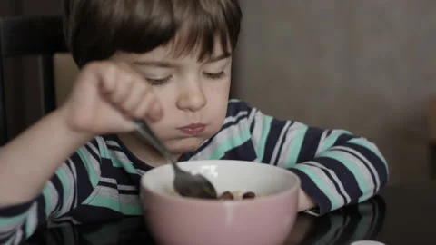 Little Hungry Boy Eating Breakfast Corn ... | Stock Video | Pond5