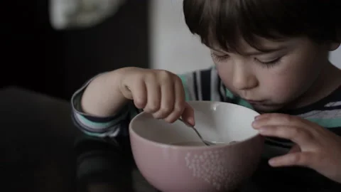 Little Hungry Boy Eating Breakfast Corn ... | Stock Video | Pond5