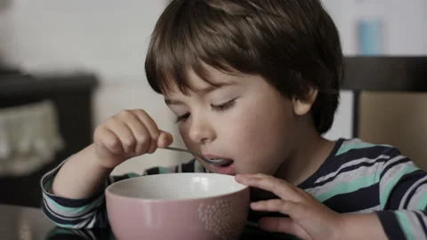 Little Hungry Boy Eating Breakfast Corn ... | Stock Video | Pond5