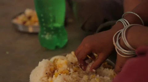 Little Indian girl eating rice with her ... | Stock Video | Pond5