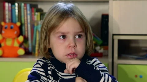 Little kid draws something near the Boo... | Stock Video | Pond5