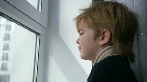 Boy Looking Out Window Stock Video Footage | Royalty Free Boy Looking ...