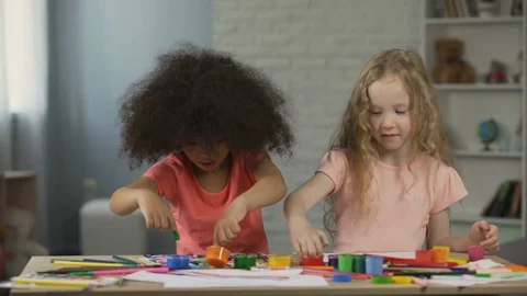 Little multiethnic girls smudging hands ... | Stock Video | Pond5