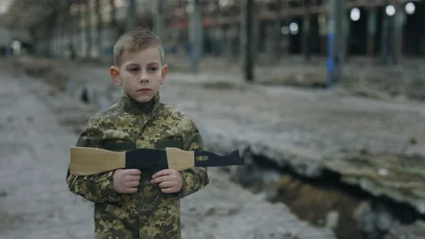 Little Soldier Wearing Military Uniform ... | Stock Video | Pond5