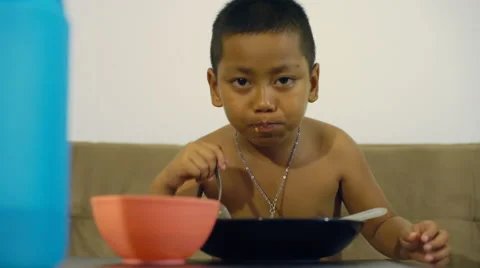 Little Thai boy eating rice 4k UHD (3840... | Stock Video | Pond5