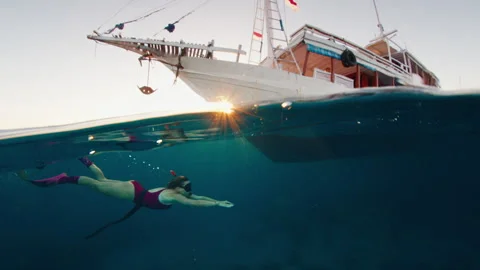 Live aboard and freediving. Woman freedi... | Stock Video | Pond5