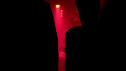 Live concert with red stage lights in th... | Stock Video | Pond5