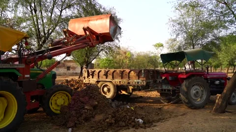 loader tractor rides on agriculture fiel... | Stock Video | Pond5