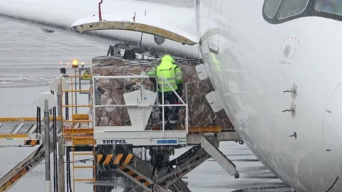 Loading an aircraft using a lift ramp at... | Stock Video | Pond5