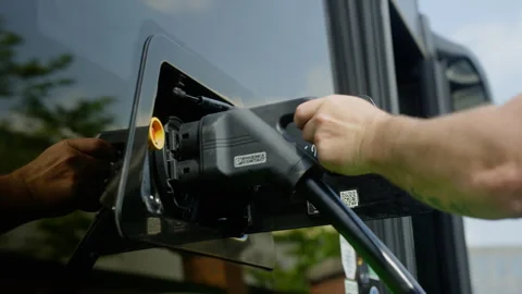 Loading electric Vehicle - charging e-Bu... | Stock Video | Pond5