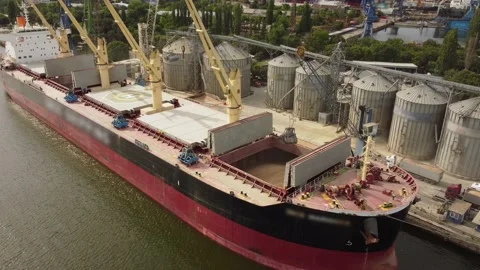Loading grain into sea cargo vessel in s... | Stock Video | Pond5