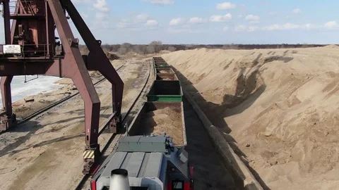 loading sand into rail cars with the hel... | Stock Video | Pond5