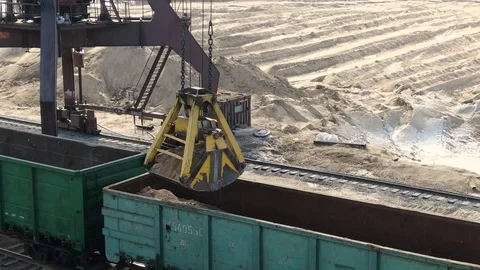 loading sand into rail cars with the hel... | Stock Video | Pond5