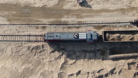 loading sand into rail cars with the hel... | Stock Video | Pond5