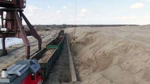 loading sand into rail cars with the hel... | Stock Video | Pond5