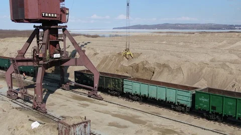 loading sand into rail cars with the hel... | Stock Video | Pond5