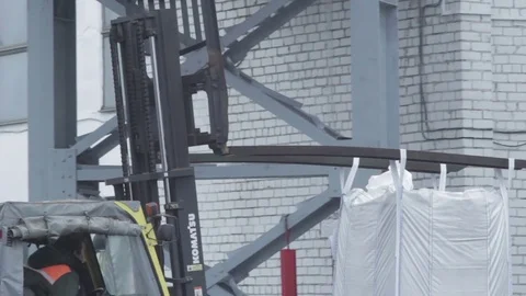 Loading truck with bales of polymer chip... | Stock Video | Pond5