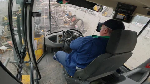 Loading a truck with a front loader at a... | Stock Video | Pond5