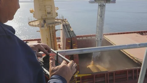 Loading wheat into a large cargo ship. L... | Stock Video | Pond5