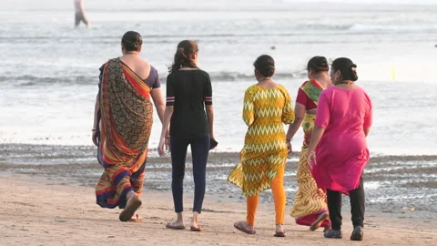 Local indian women walk beach. Native re... | Stock Video | Pond5