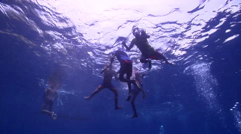 Local kids playing up to the camera swim... | Stock Video | Pond5