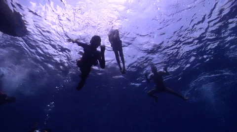 Local kids playing up to the camera swim... | Stock Video | Pond5