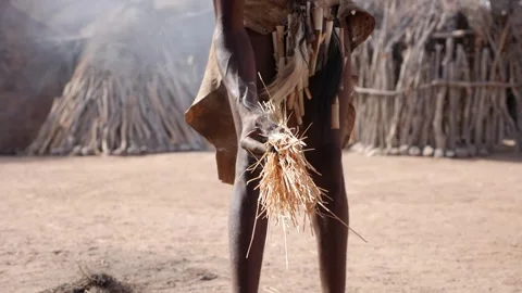 Local man from Damara tribe making a fir... | Stock Video | Pond5