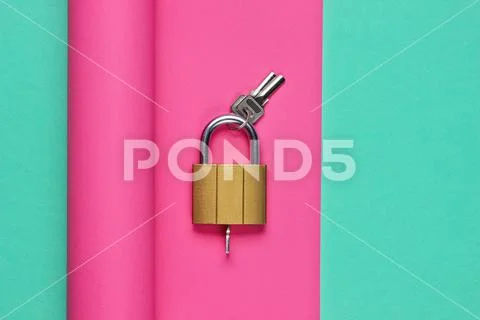 Lock with key on wrapped paper background. Pastel color trend ...