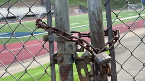 Locked football stadium gate entrance | Stock Video | Pond5