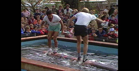 LOG BALANCING COMPETITION / SPORT - (19... | Stock Video | Pond5