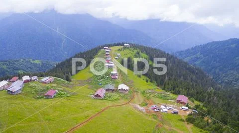 Log houses at The Pokut Plateau with foogy background at Rize. Stock ...